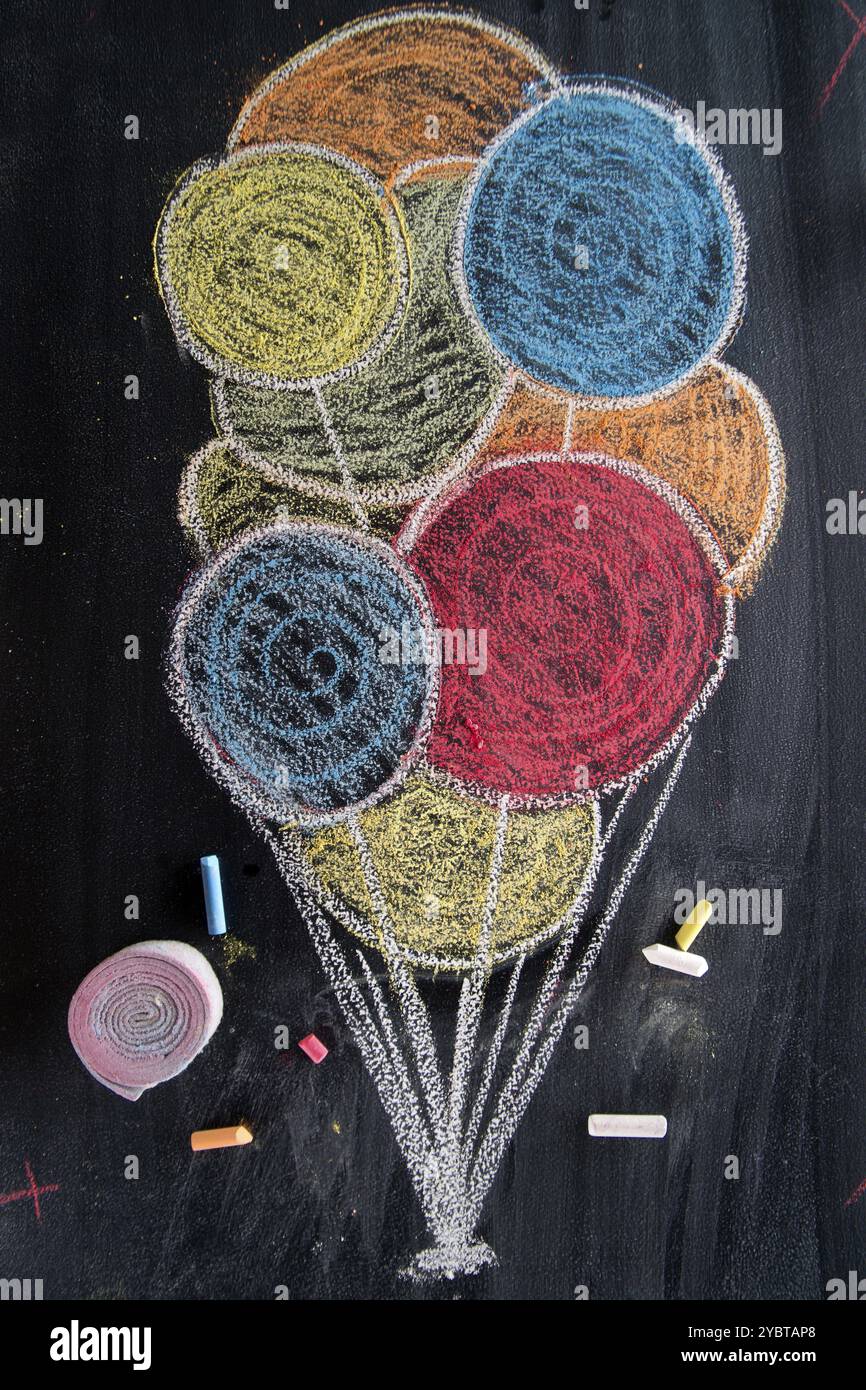 Graphic representation of colored balloons drawn with chalk on ...