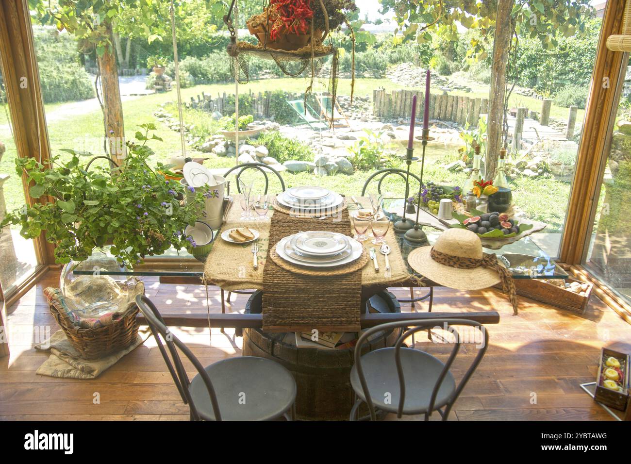 Dining table set for two people overlooking the garden in summ Stock ...