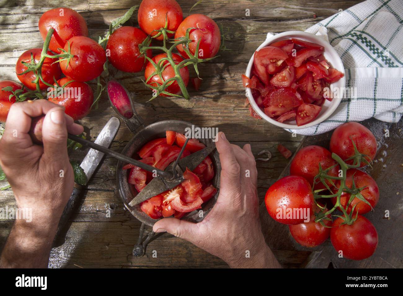 Preparation with strainer preserve fresh smooth round tomato Stock ...