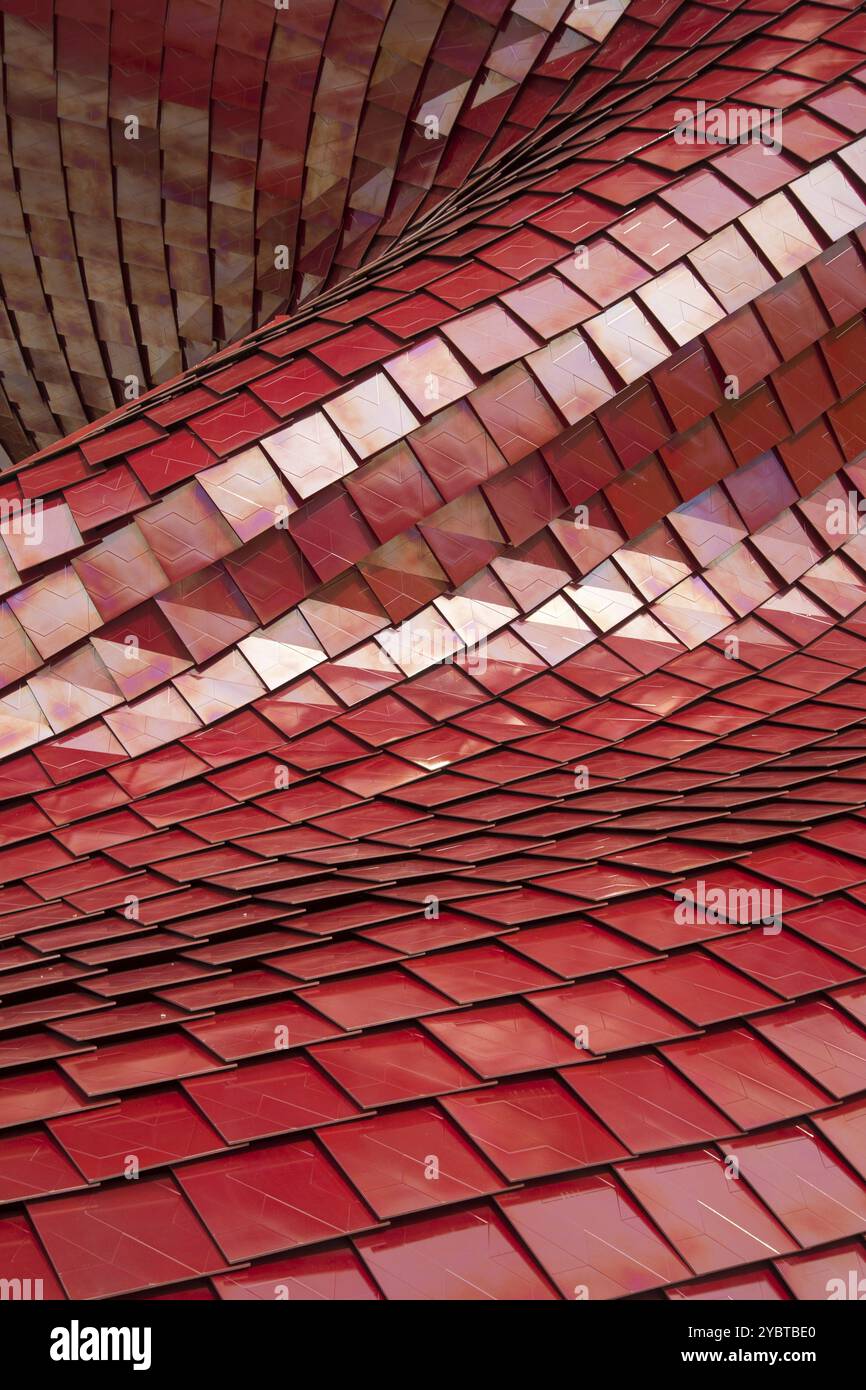 Covering of a building with the use of modern tiles of red color Stock ...