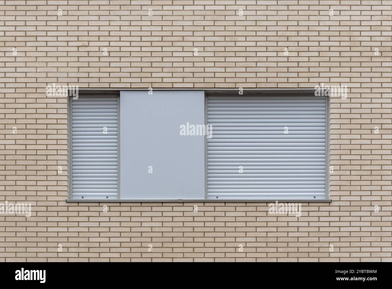 Detail of window of contemporary row houses with brick facade ...