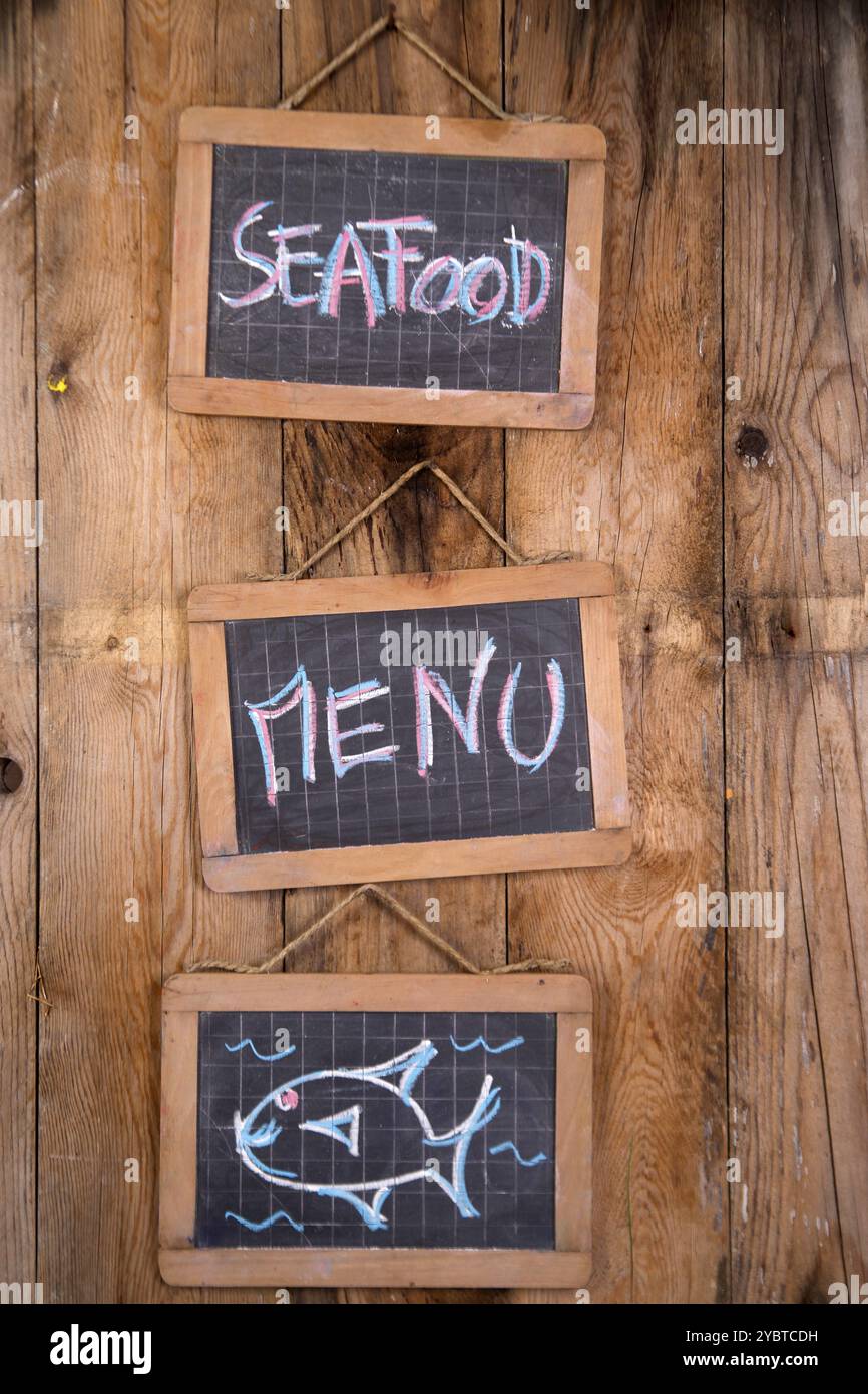 Sign for advertising menu a restaurant serving fish Stock Photo - Alamy