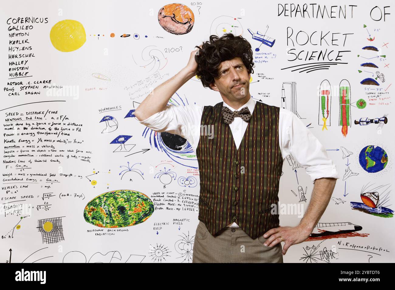 Middle aged caucasian rocket scientist standing in front of astronomy ...