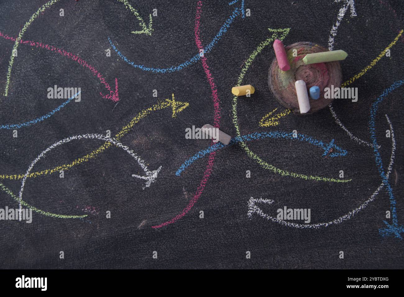 Curved colored arrows drawn with chalk on blackboard Stock Photo - Alamy