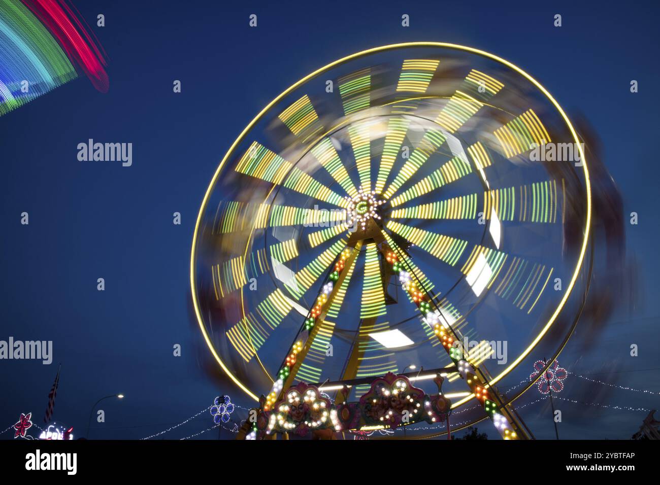 Photographic documentation of a Ferris wheel inside an amusement park ...