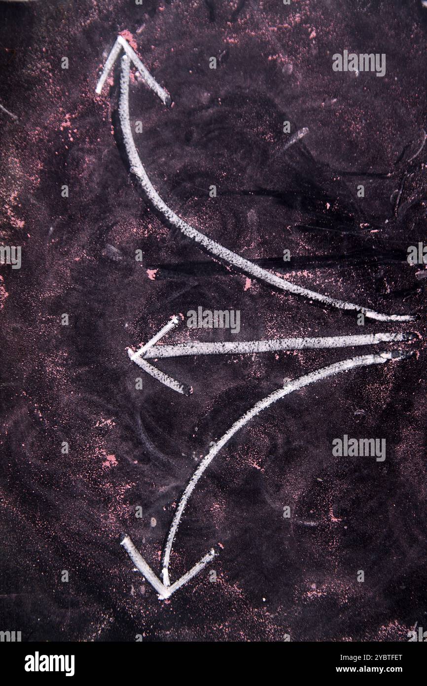 Graphical representation with chalk on blackboard three arrows showing ...