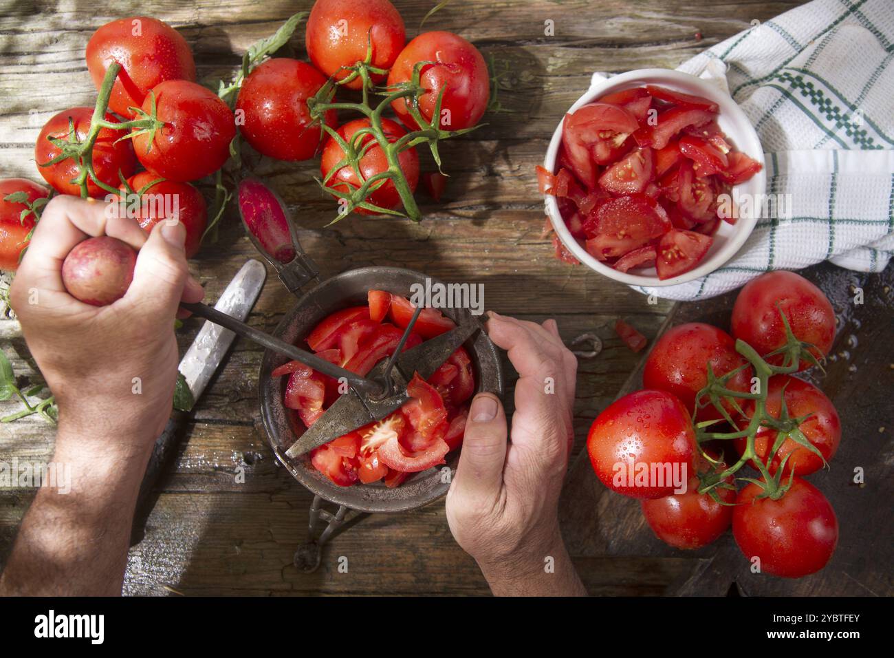 Preparation with strainer preserve fresh smooth round tomato Stock ...