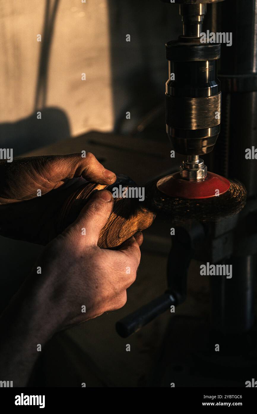 Hands polishing wooden object with Stock Photo - Alamy
