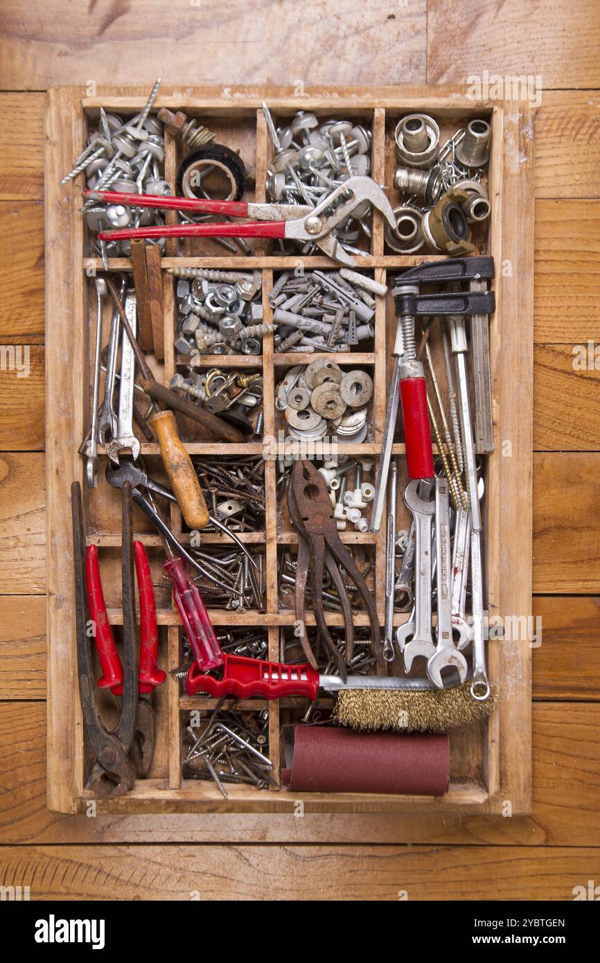 Wooden box containing small tools for household chores Stock Photo - Alamy