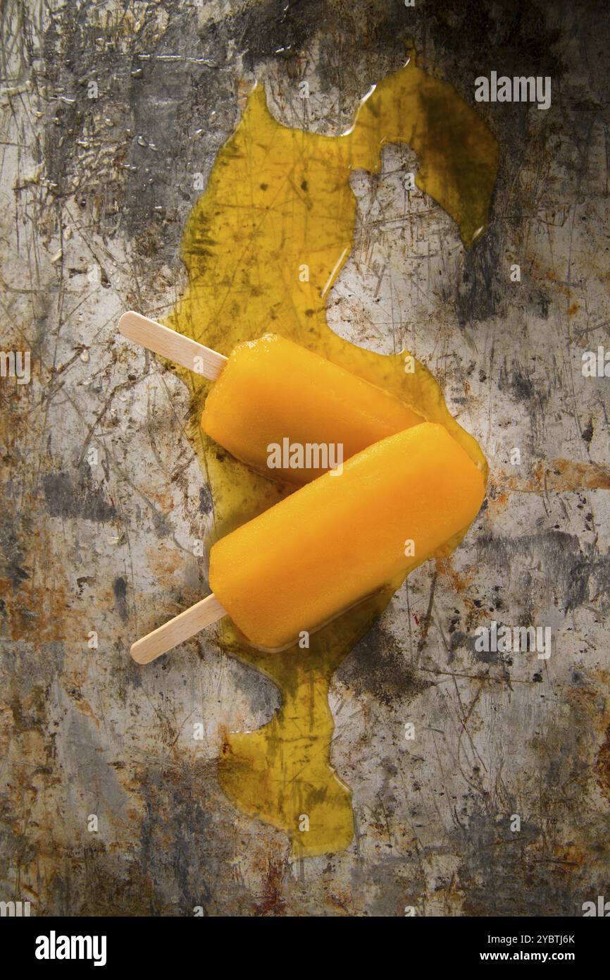 Effect of melting in the heat of the all fruit popsicles Stock Photo ...