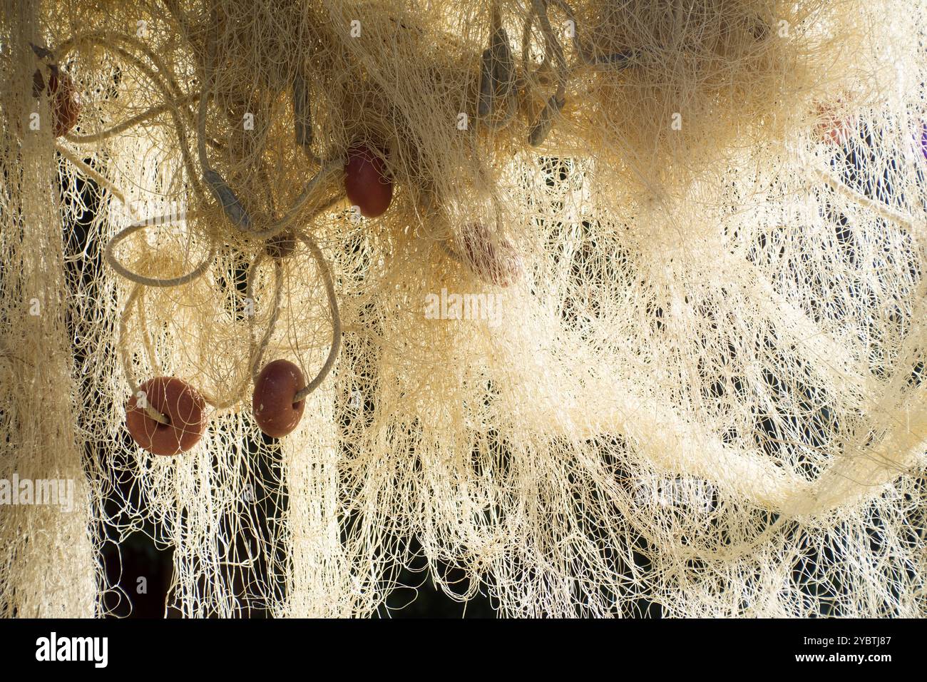 Presentation of a stretched fishing net drying in the sun Stock Photo ...