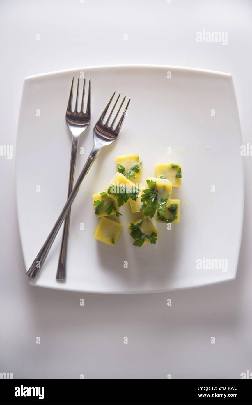 Frozen cubes of extra virgin olive oil flavored with parsley Stock ...