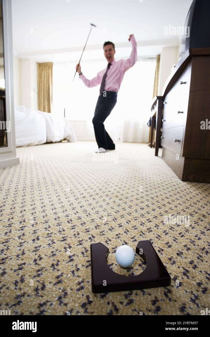 Business executive playing golf hi-res stock photography and images - Alamy
