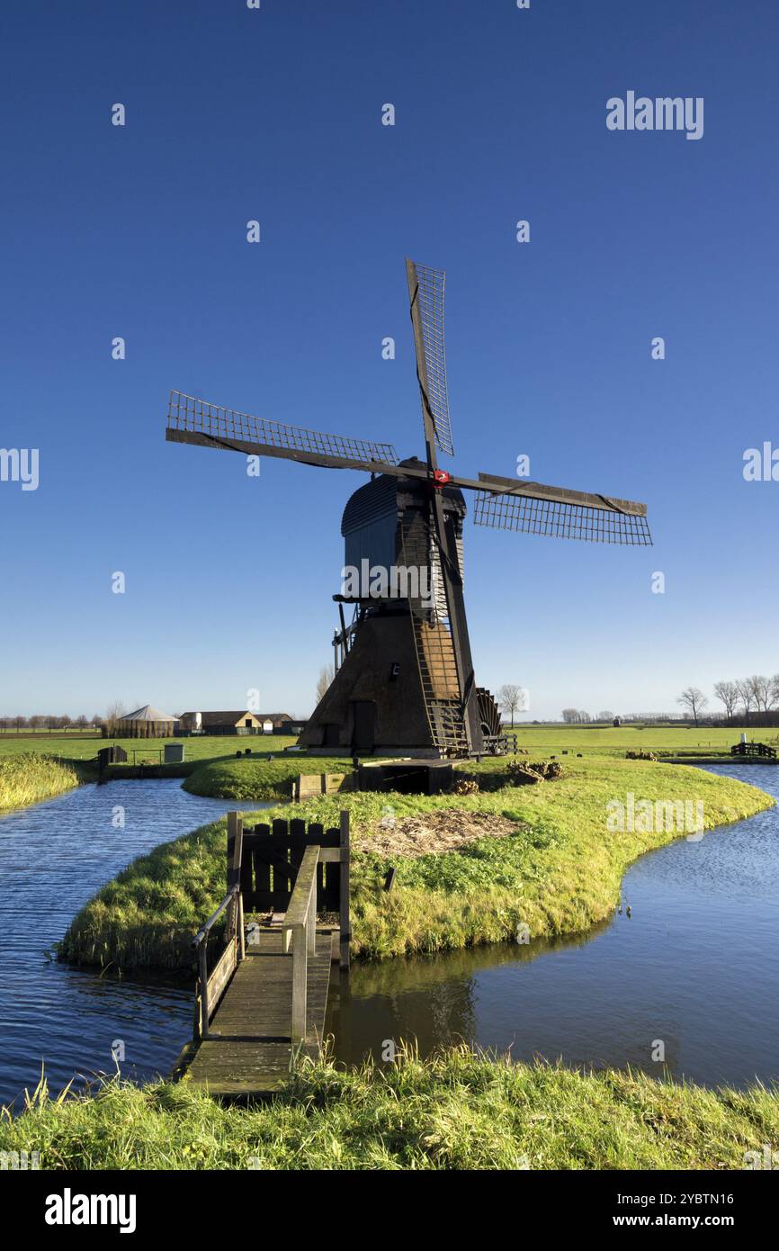 Bridge to the Noordeveldse windmill near the Dutch village Dussen with ...