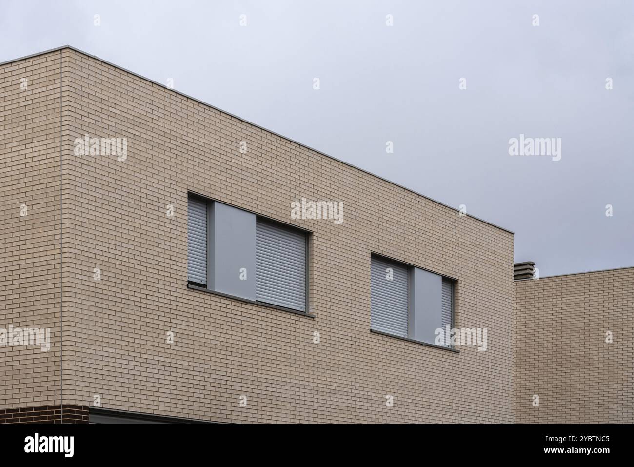 Detail of window of contemporary row houses with brick facade ...