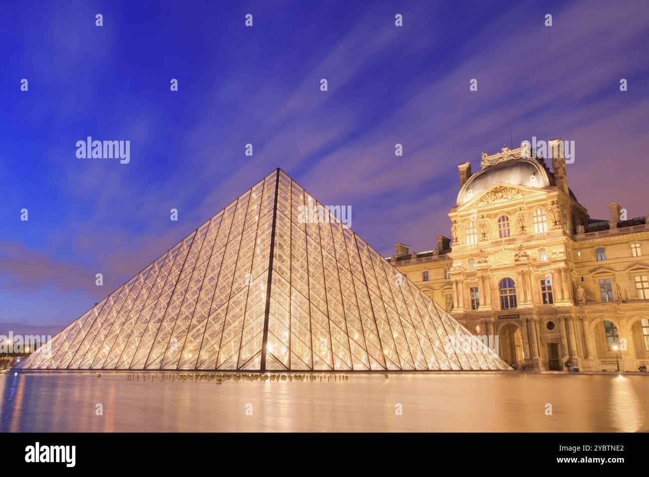 The Louvre Pyramid at dusk Stock Photo - Alamy