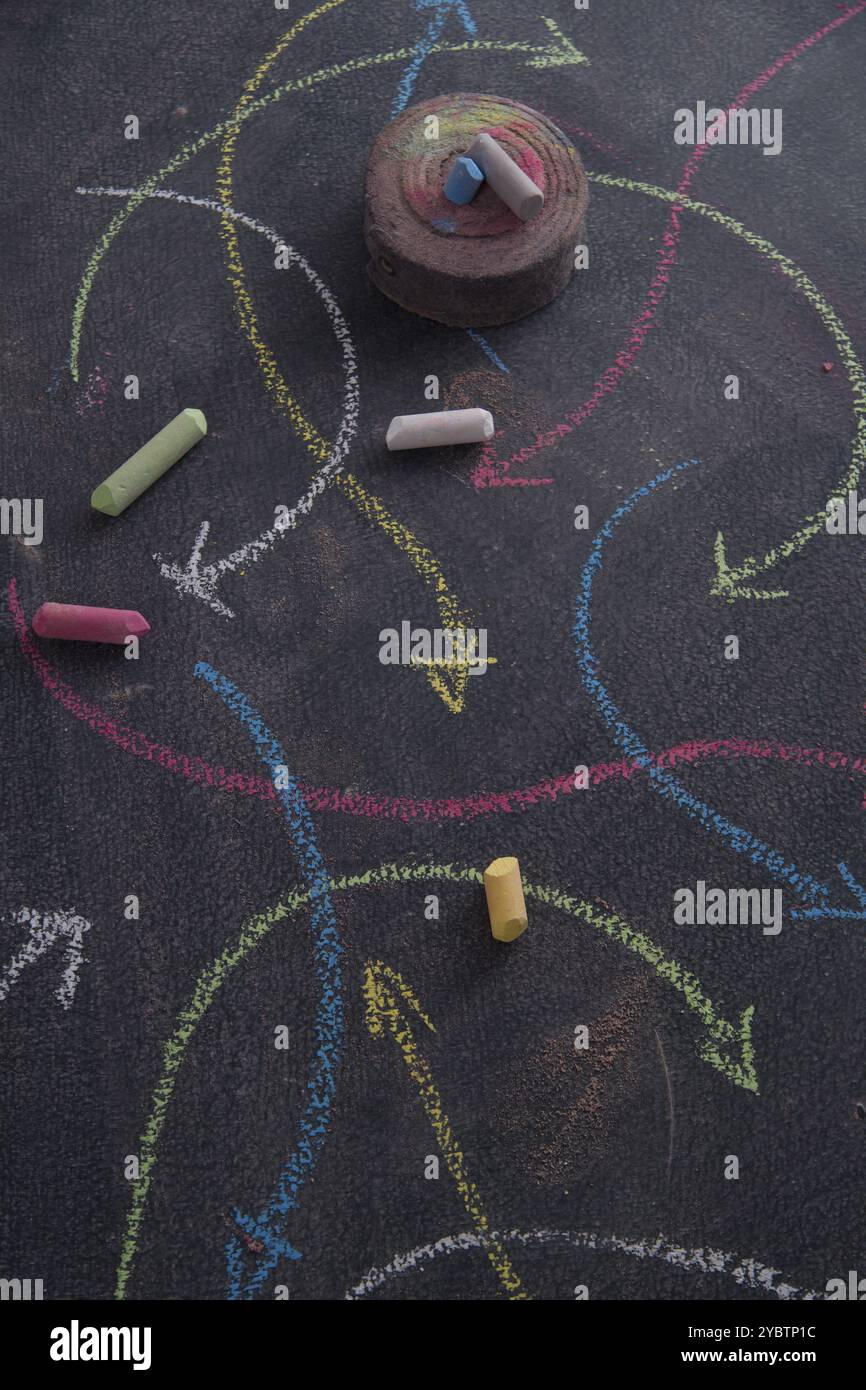 Curved colored arrows drawn with chalk on blackboard Stock Photo - Alamy