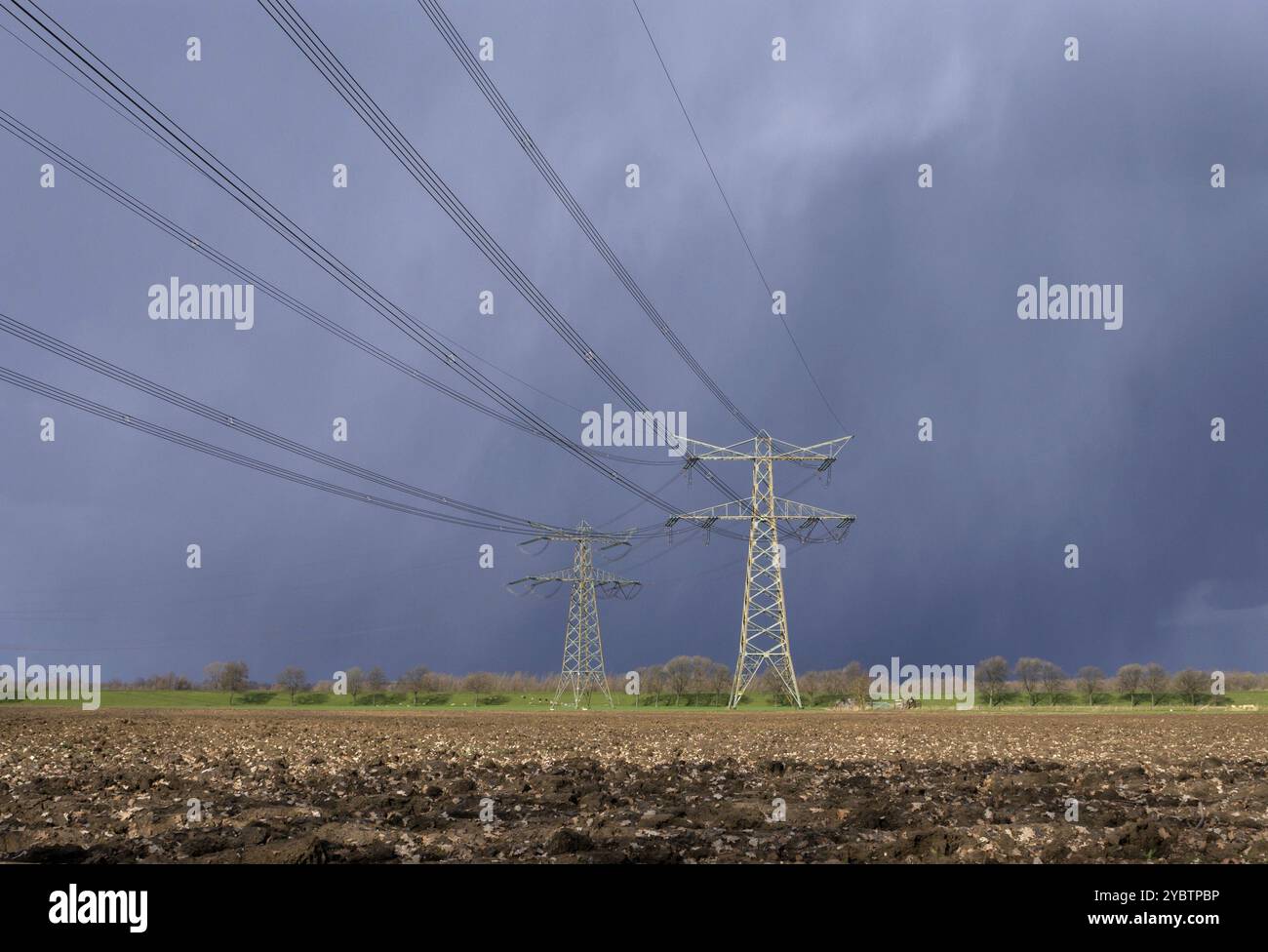 Power pylon on the Isle of Dordrecht just before the hit of a heavy ...