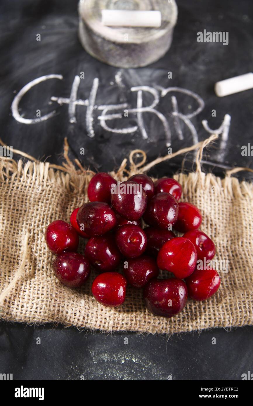 Presentation of a group of cherries on a black background Stock Photo ...