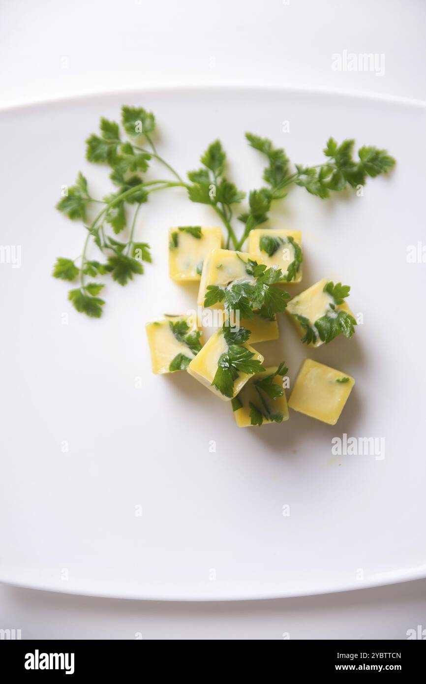 Frozen cubes of extra virgin olive oil flavored with parsley Stock ...