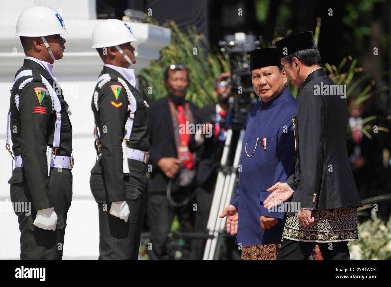 Indonesia's newly-inaugurated President Prabowo Subianto, second right ...