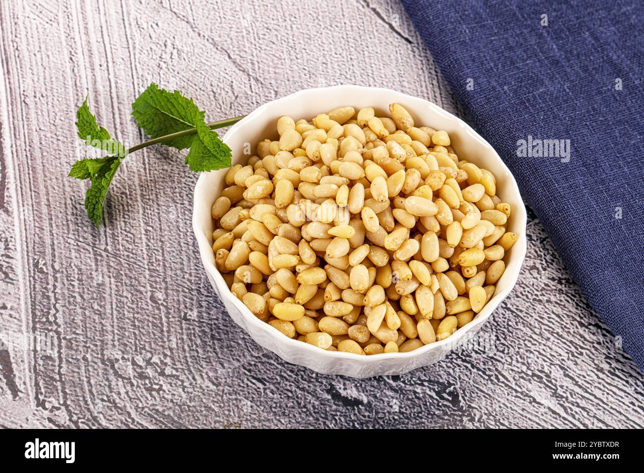 Delicous Peeled cedar nut in the bowl Stock Photo - Alamy