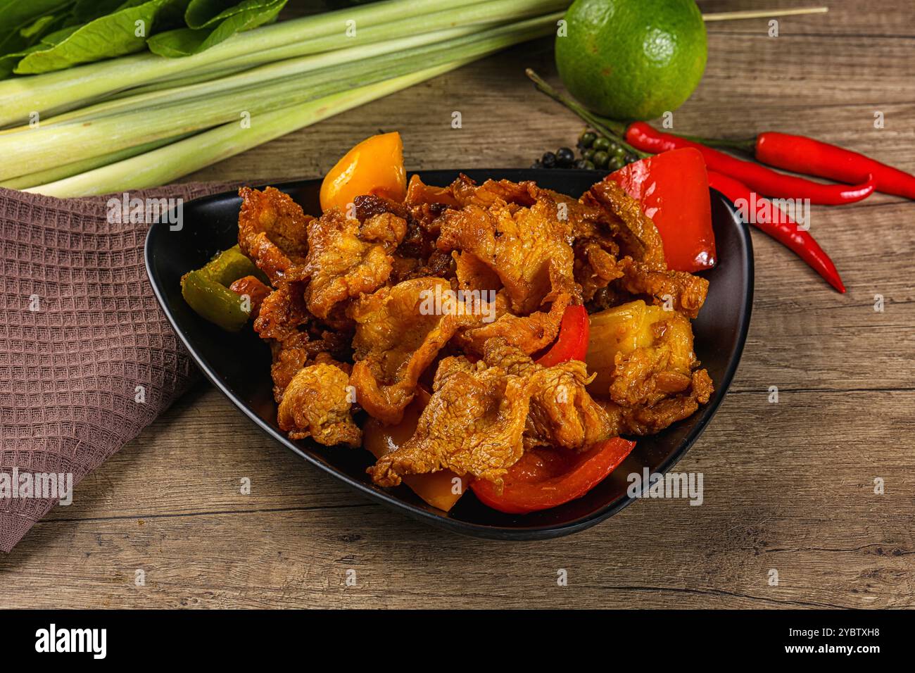 Asian cuisine - roasted crocodile meat with vegetables Stock Photo - Alamy