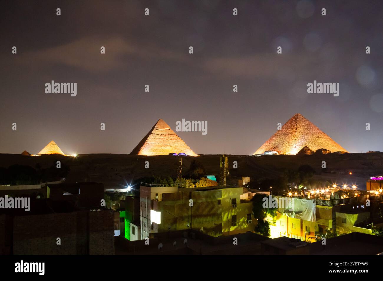 The Great Pyramid complex enlighted at night, Giza, Egypt Stock Photo ...