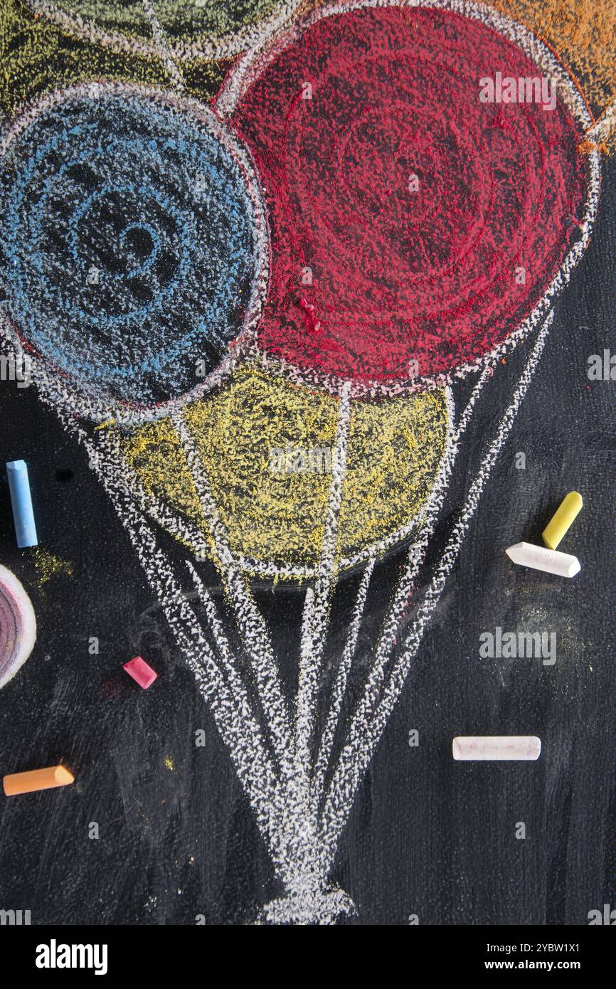 Graphic representation of colored balloons drawn with chalk on ...