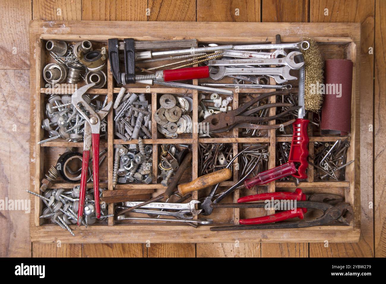 Wooden box containing small tools for household chores Stock Photo - Alamy