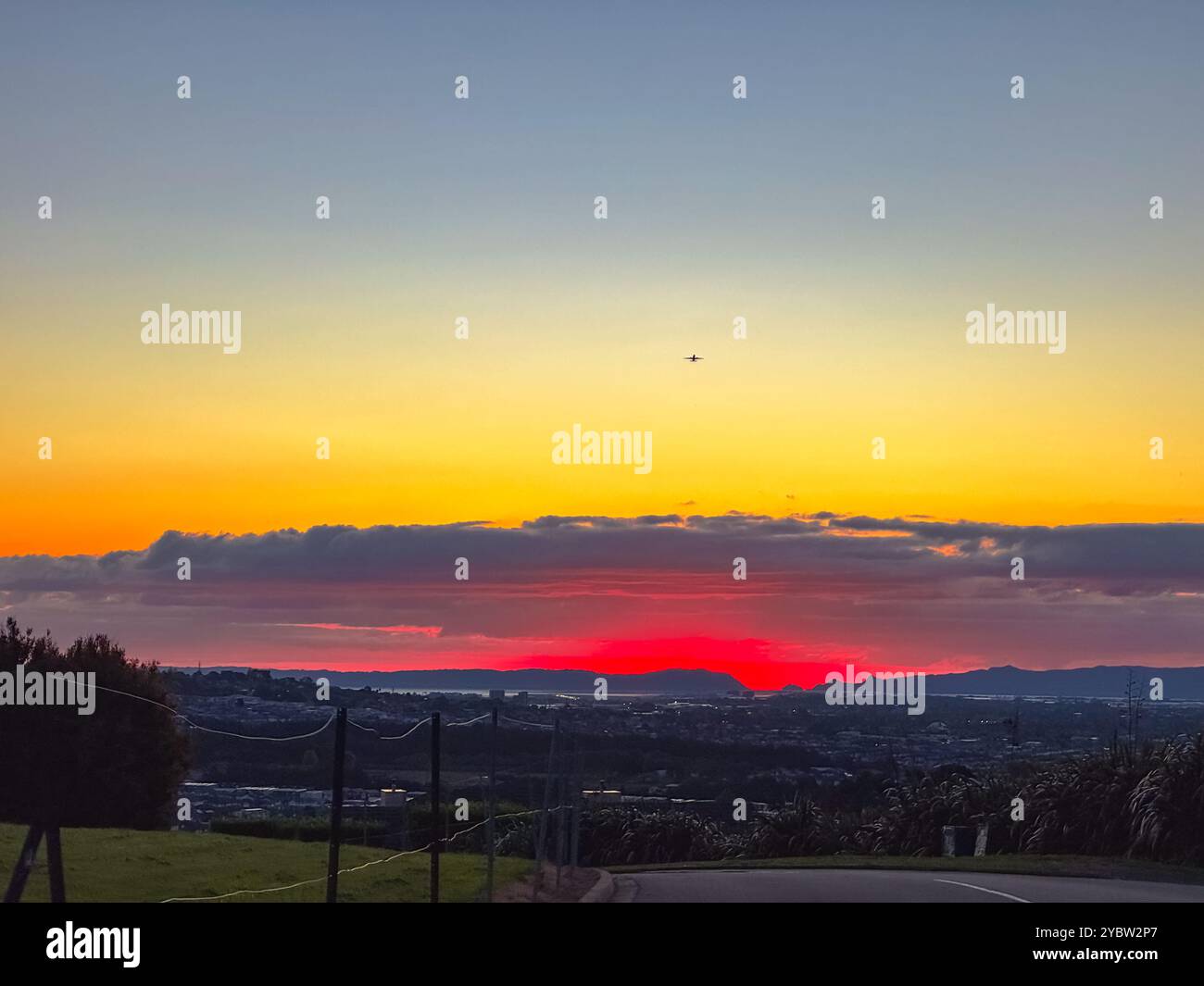 A view of high-ground hills in Auckland lays of sunlights on the ...
