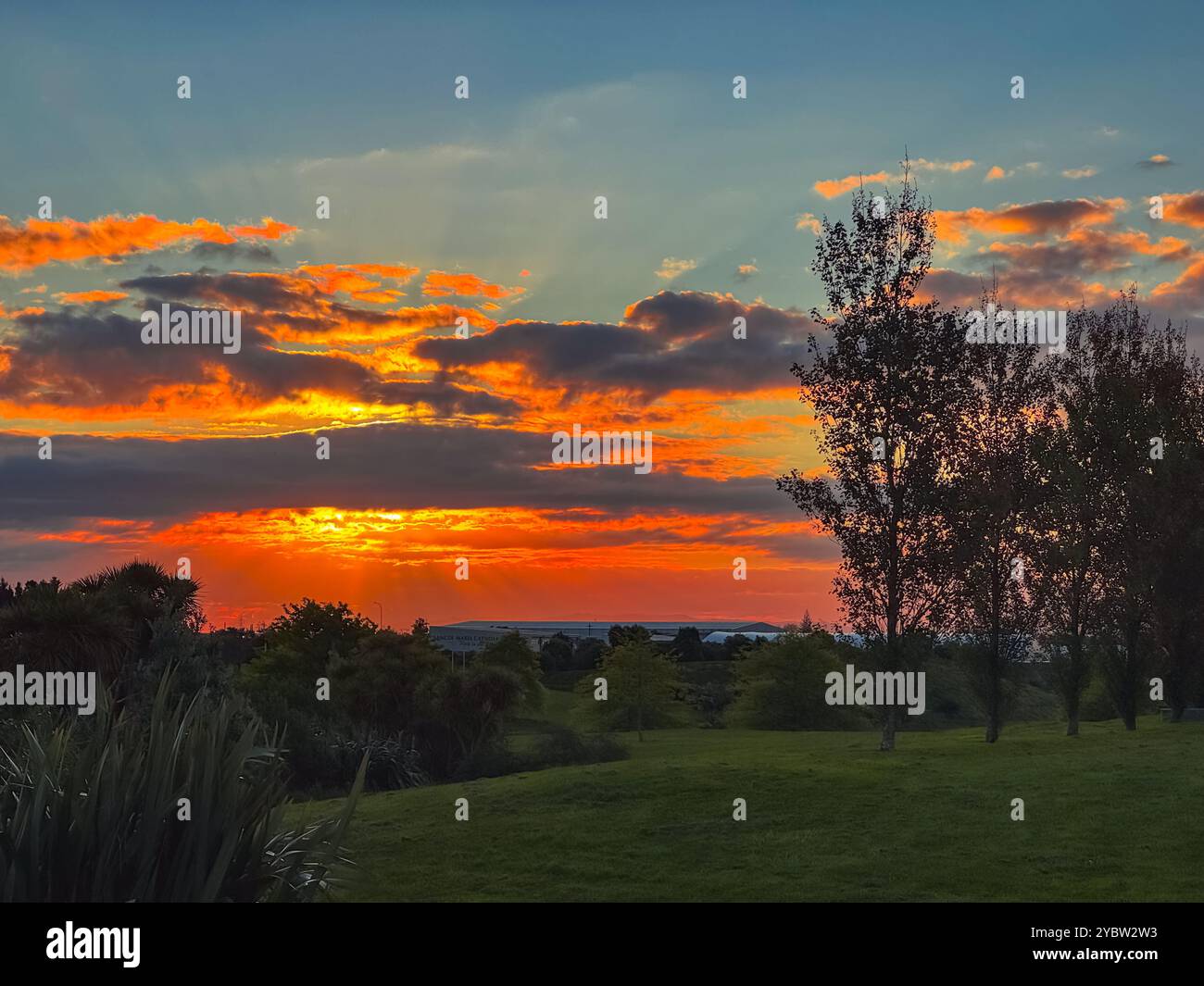 A view of high-ground hills in Auckland lays of sunlights on the ...