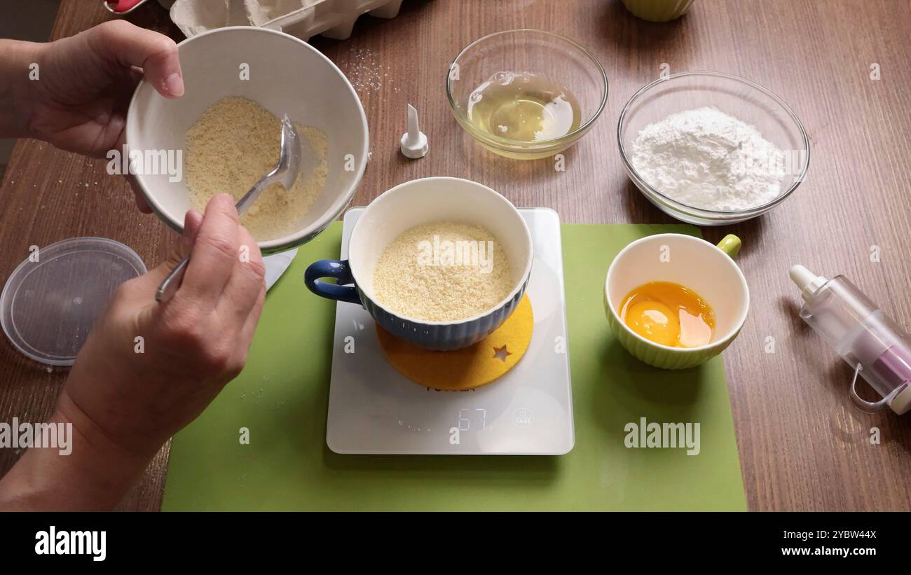 Process of preparing scales and utensils for making dough. Woman weighs ...