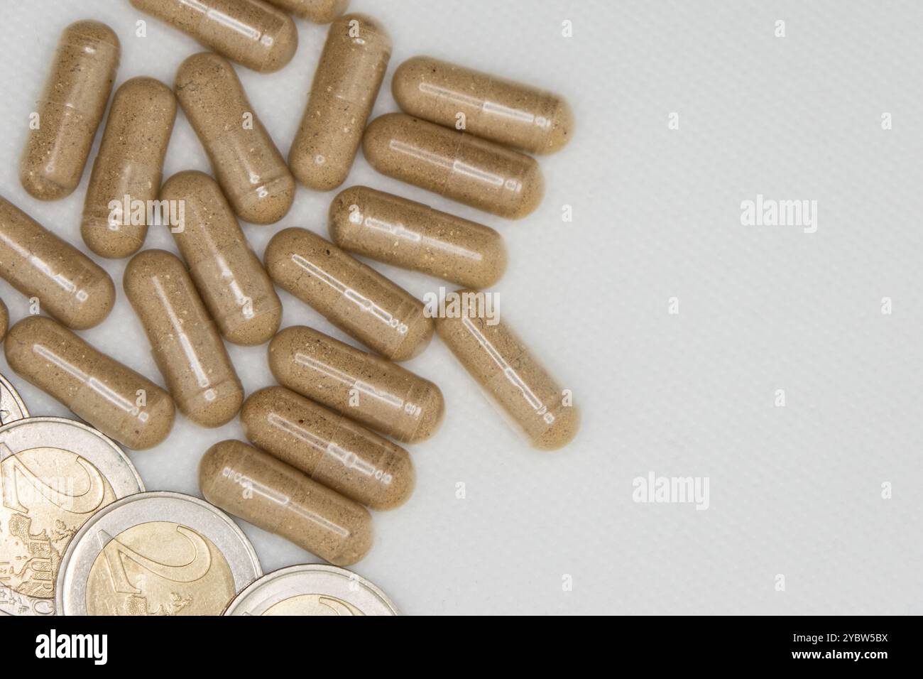 Pills medicine next euro coins hi-res stock photography and images - Alamy