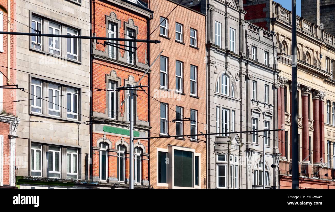 Facades of various buildings in Dublin, showcasing a contrast of red ...