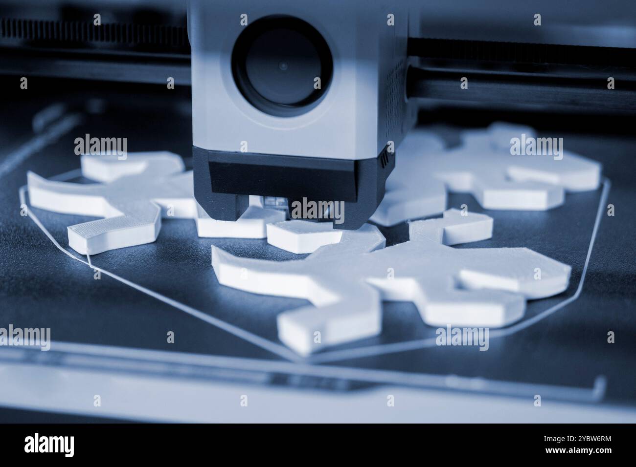 Process of printing on 3D printer. 3D printer creating model from molten plastic close-up ...