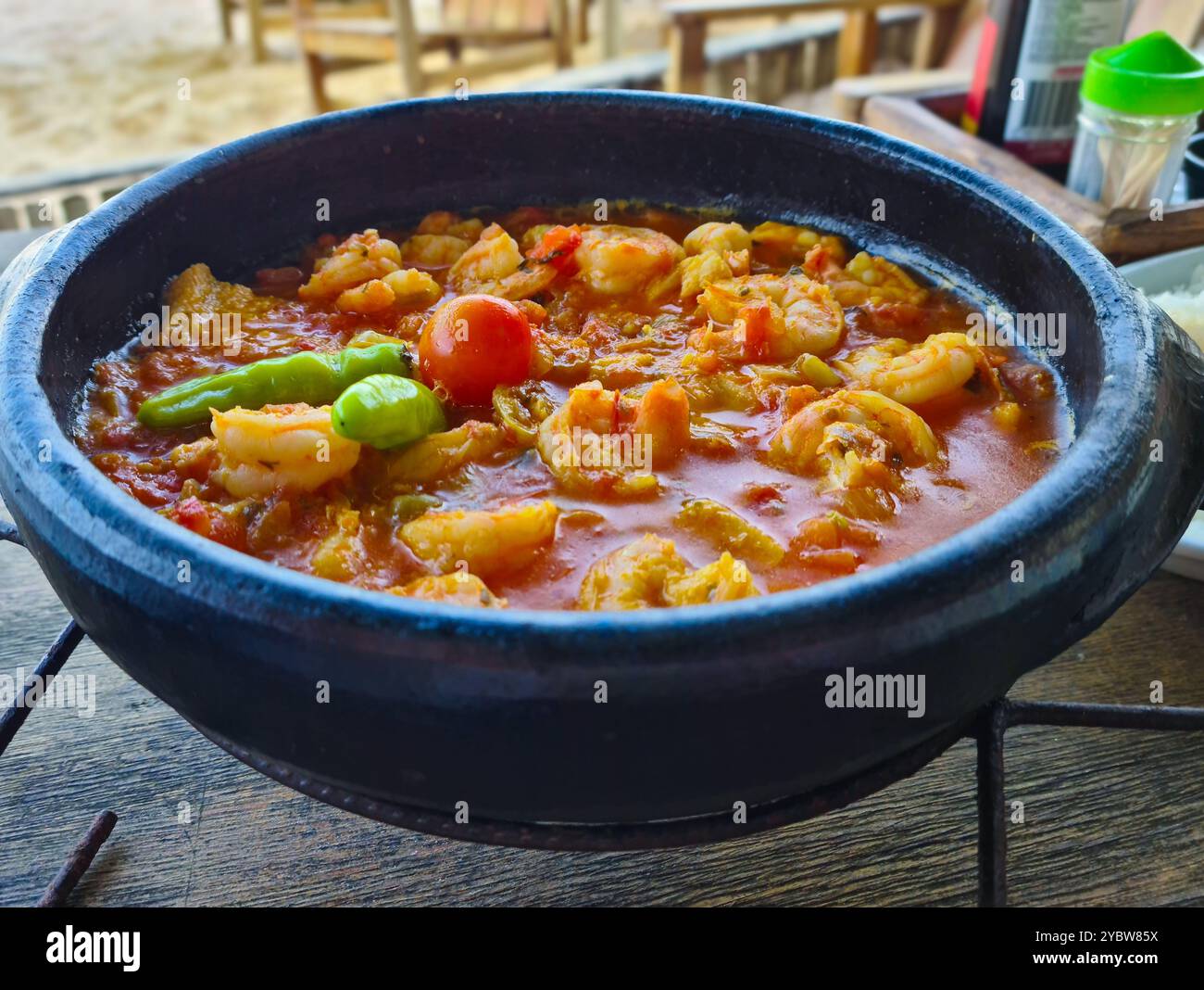 Moqueca, a traditional Brazilian dish with badejo fish and large shrimp ...