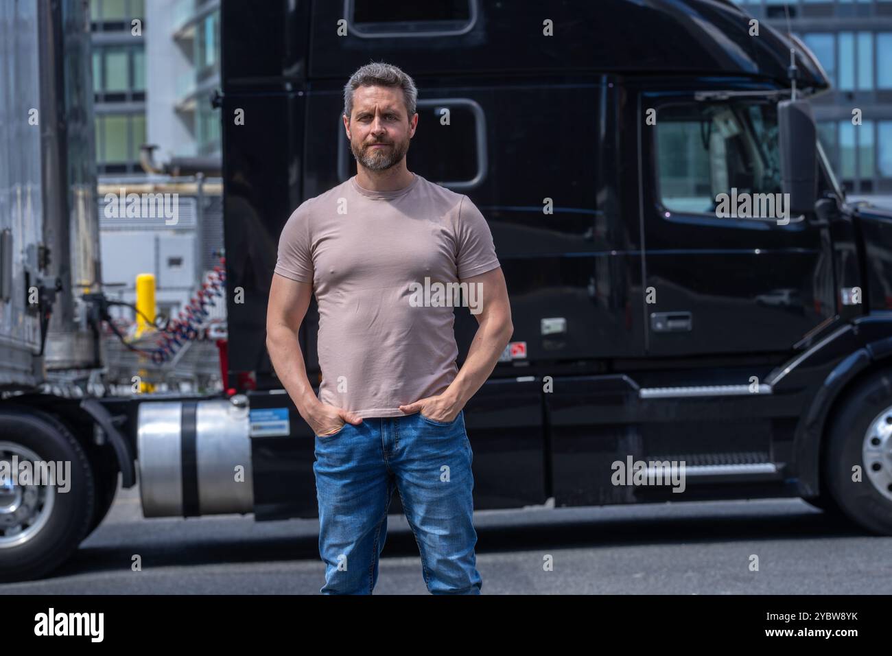 Truck driver. CDL. Portrait of trucker standing by his truck vehicle ...