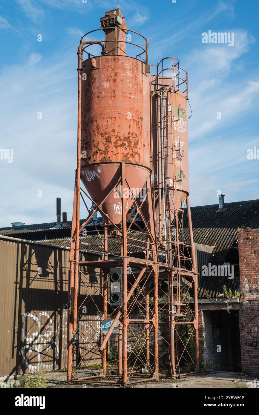 Old, rusty abandoned storage silos on a disused factory sitenear ...
