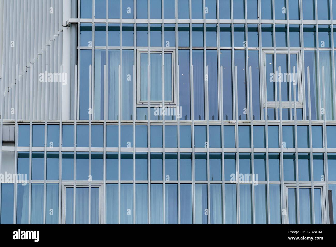 Contemporary Wall Design: Modern Building with Glass Frame and Blue ...
