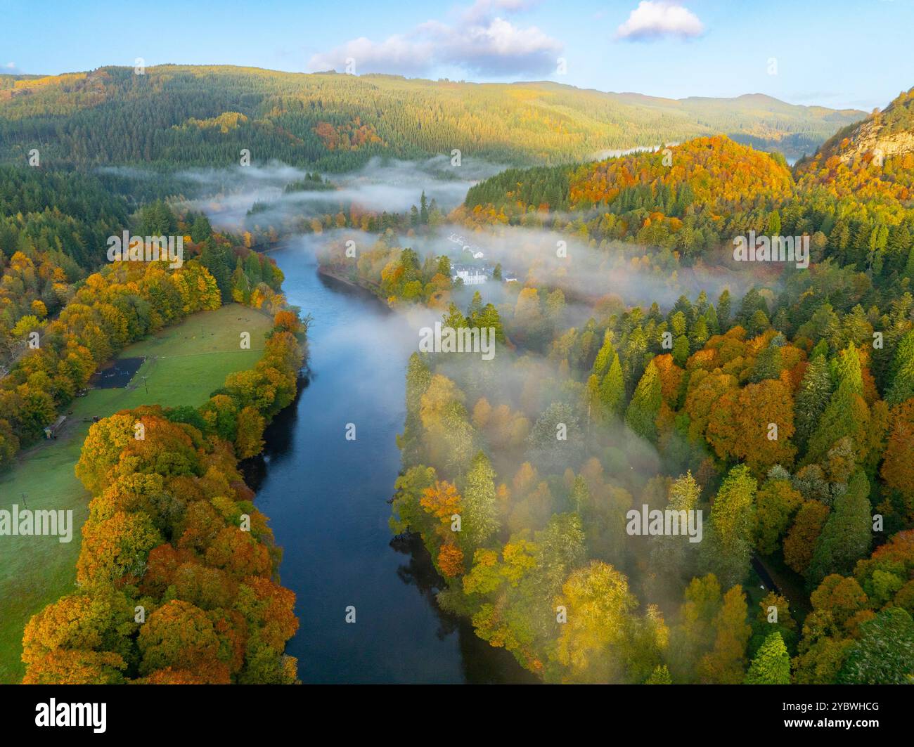 Aerial view from drone of River Tay in morning mist in autumn colours ...