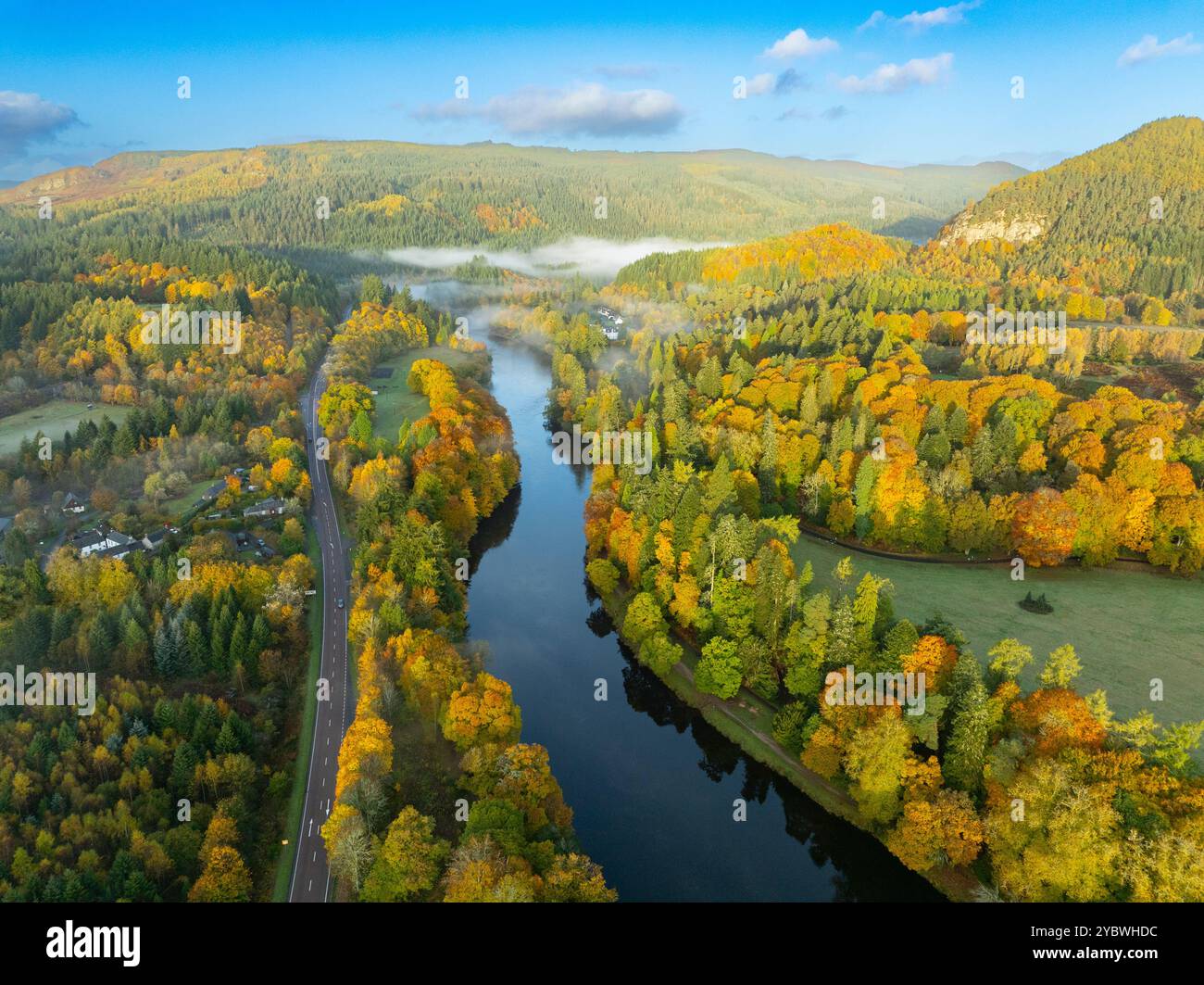 Aerial view from drone of River Tay in morning mist in autumn colours ...