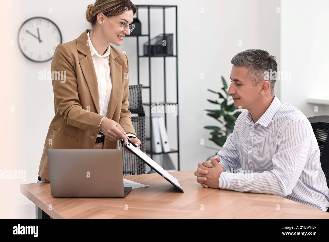 Banker working client table hi-res stock photography and images - Alamy