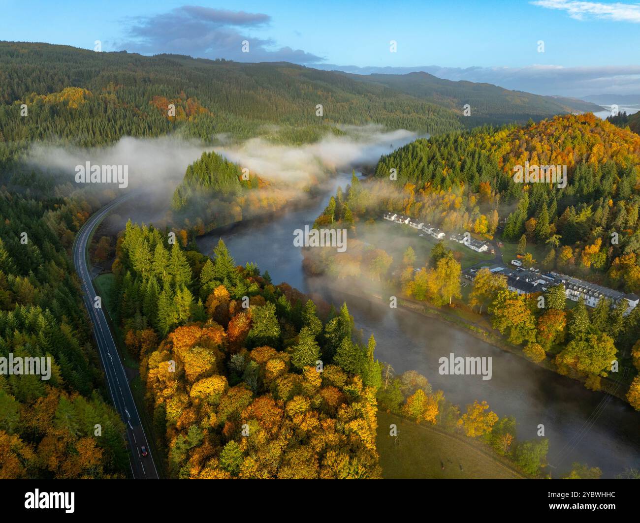 Aerial view from drone of River Tay in morning mist in autumn colours ...