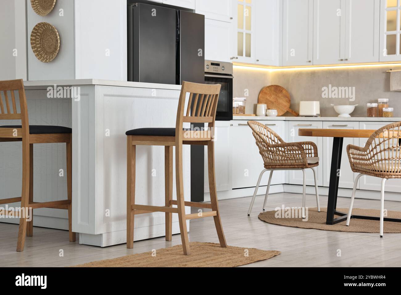 Stylish kitchen with bar stools. Interior design Stock Photo - Alamy