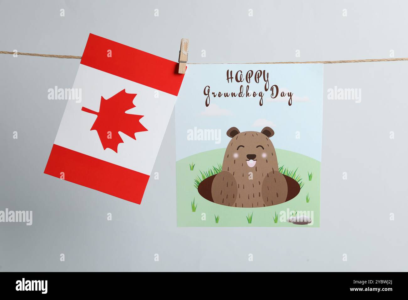 Happy Groundhog Day greeting card and Canada flag hanging on light ...