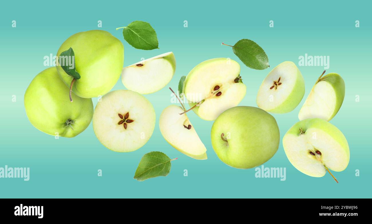 Fresh green apples in air on turquoise background Stock Photo - Alamy