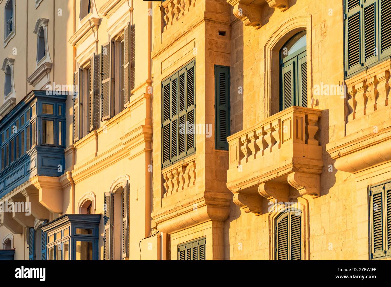 Traditional Maltese buildings with colourful balconies in historic old ...