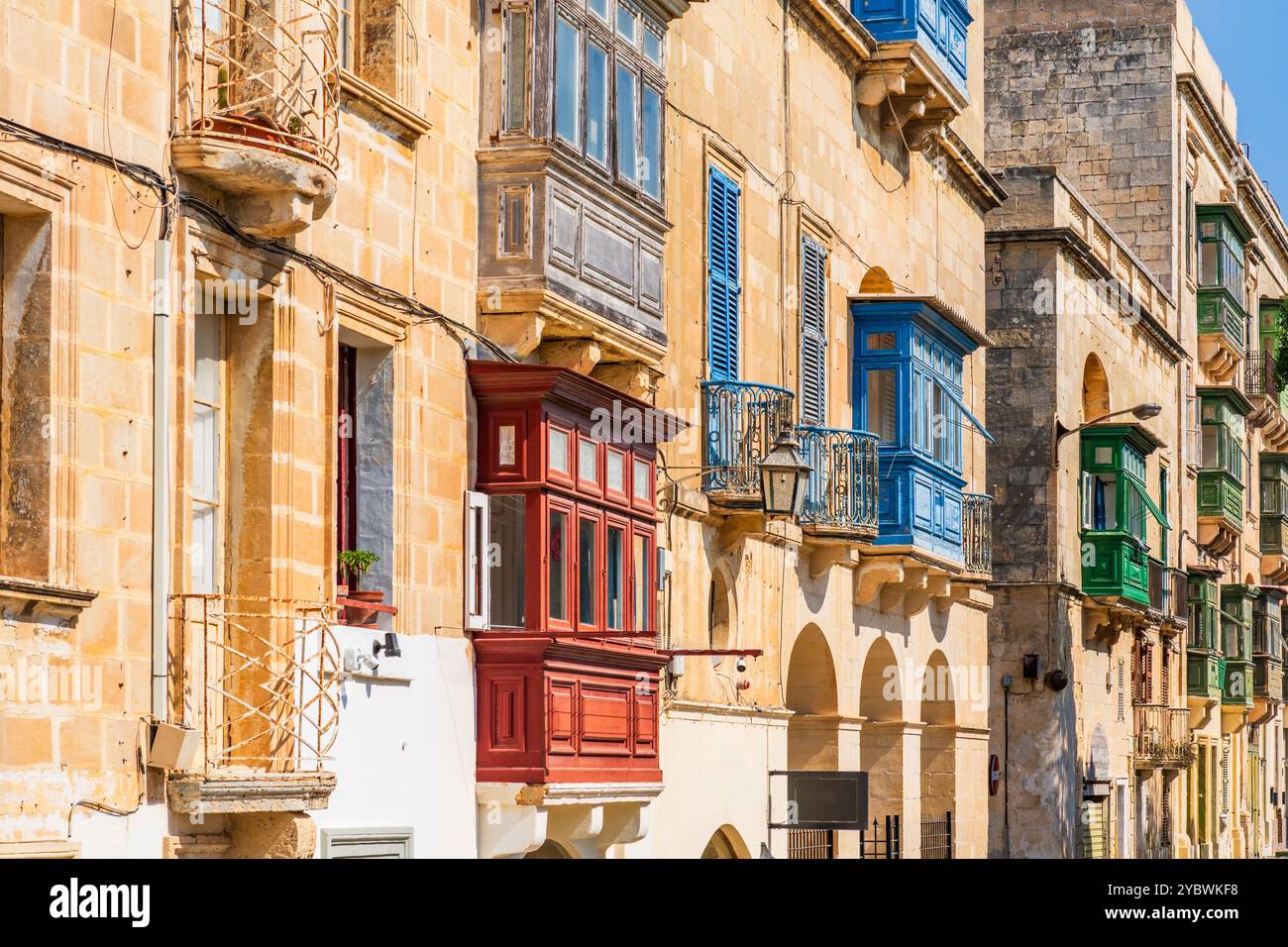 Traditional Maltese buildings with colourful balconies in historic old ...