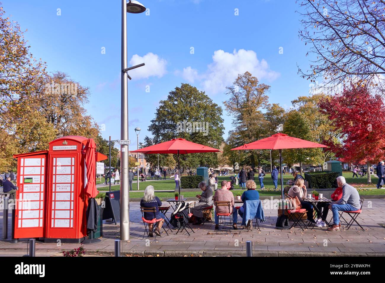 Pavement coffee shop from a converted telephone kiosk with customers ...
